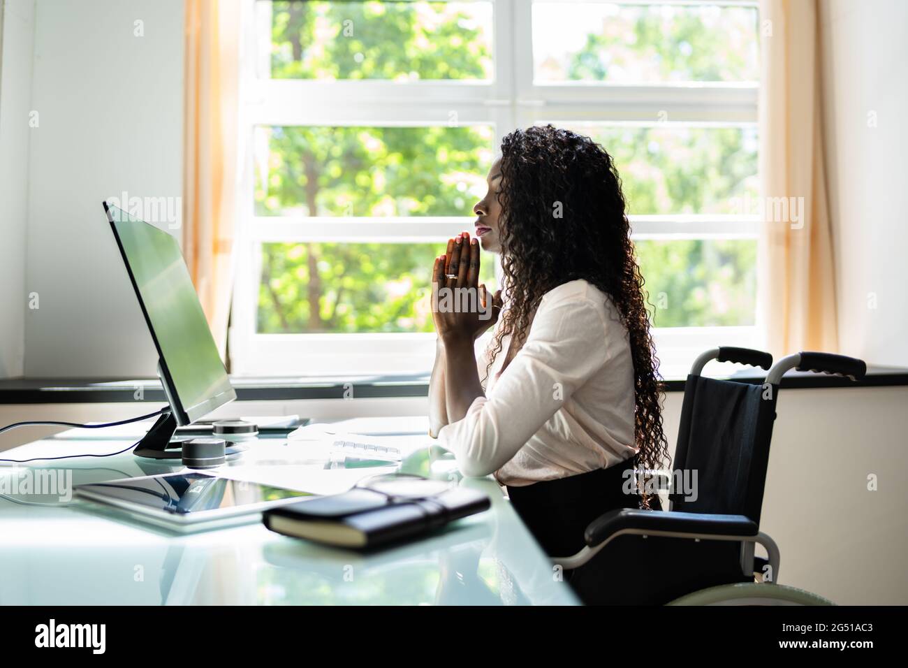 Disabled Person At Workplace In Wheelchair Doing Religious Praying ...