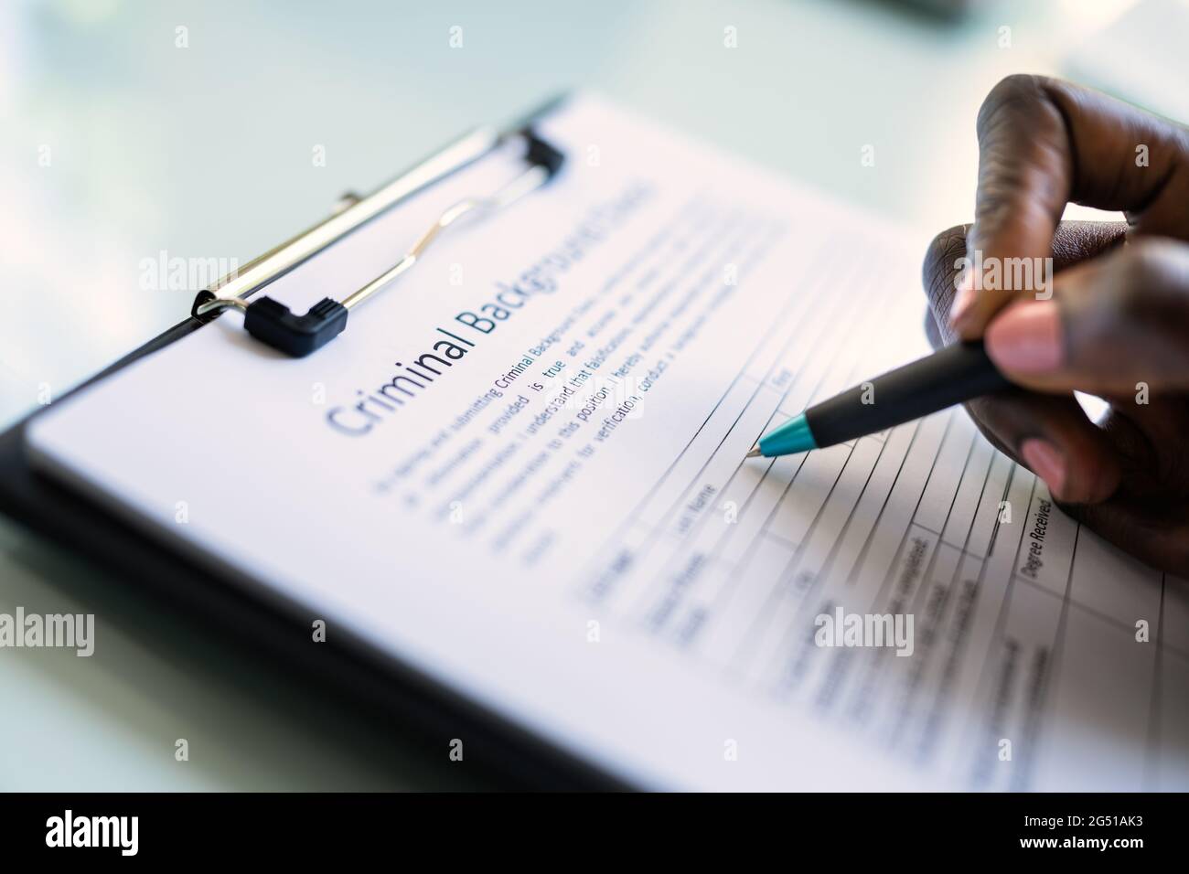 Hand Filling Criminal Background Check Application Form Stock Photo - Alamy