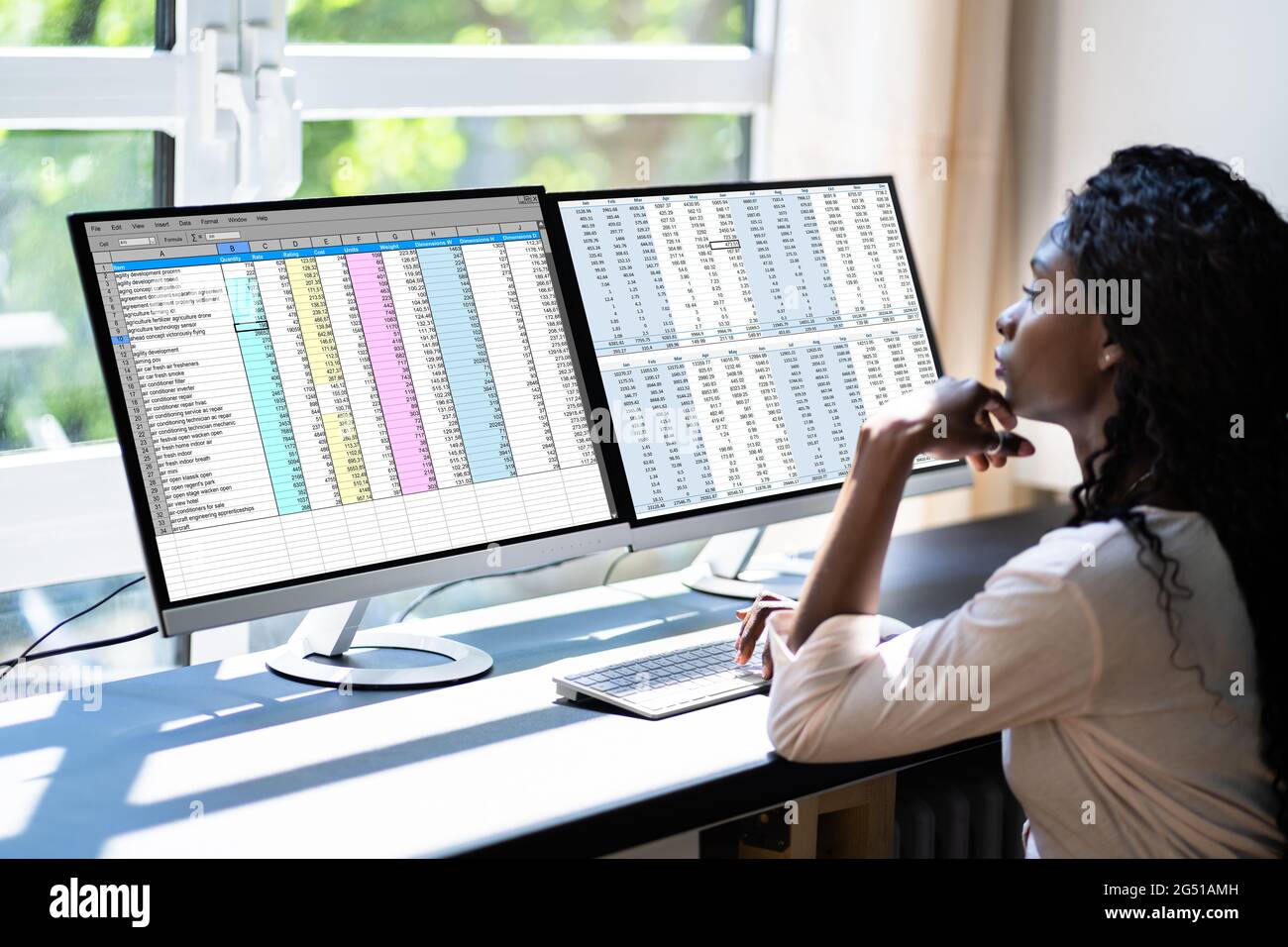 Data Analyst African Woman Using Spreadsheet On Computer Stock Photo ...