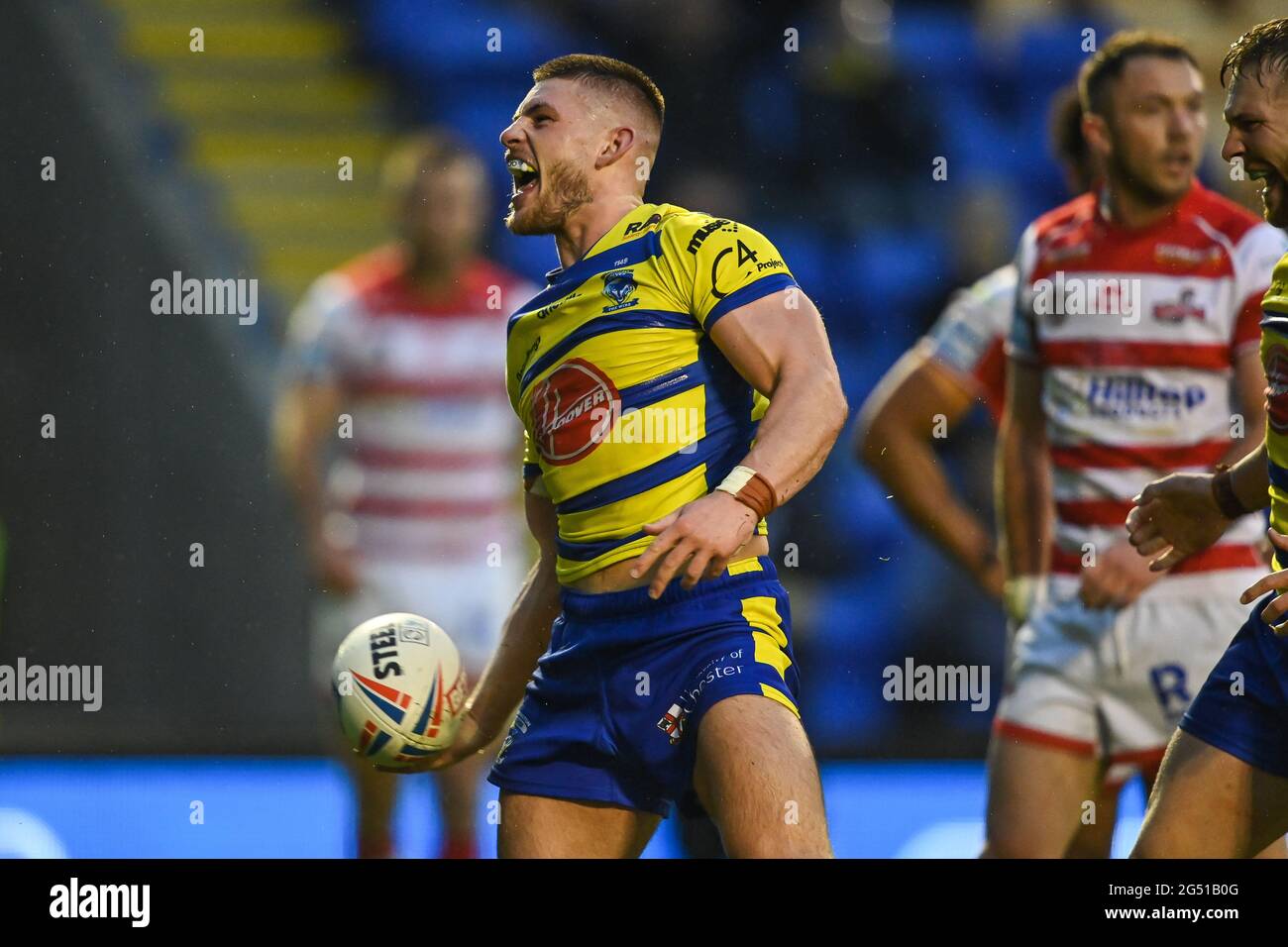 Danny Walker (16) of Warrington Wolves celebrates his try in, on 6/24 ...