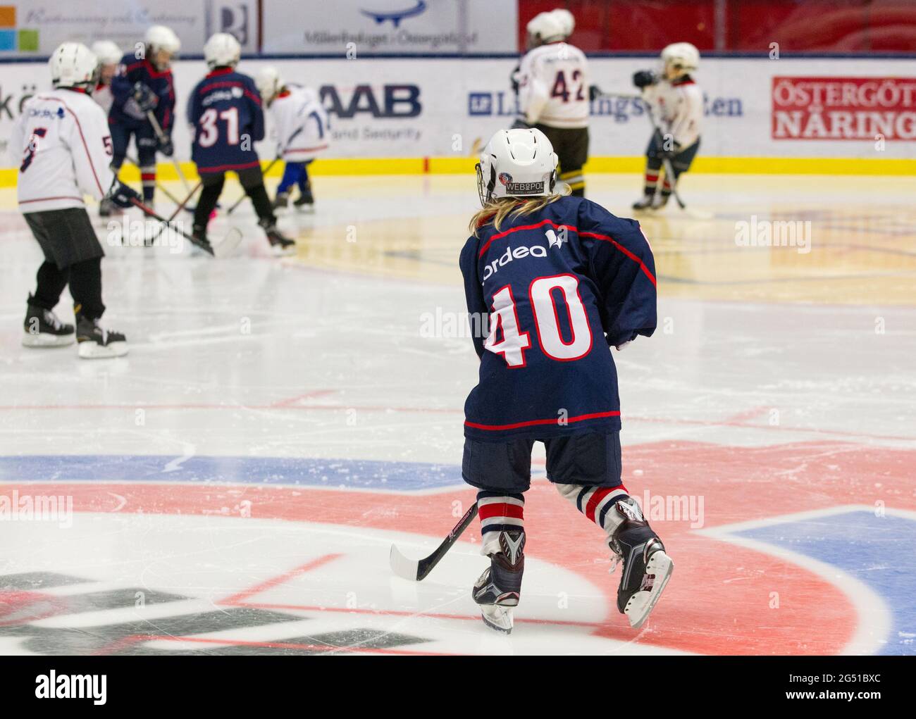 Children playing ice hockey Stock Photo - Alamy
