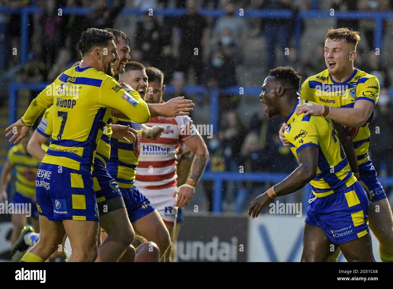 Eribe Doro (25) of Warrington Wolves celebrates scoring a try to make ...