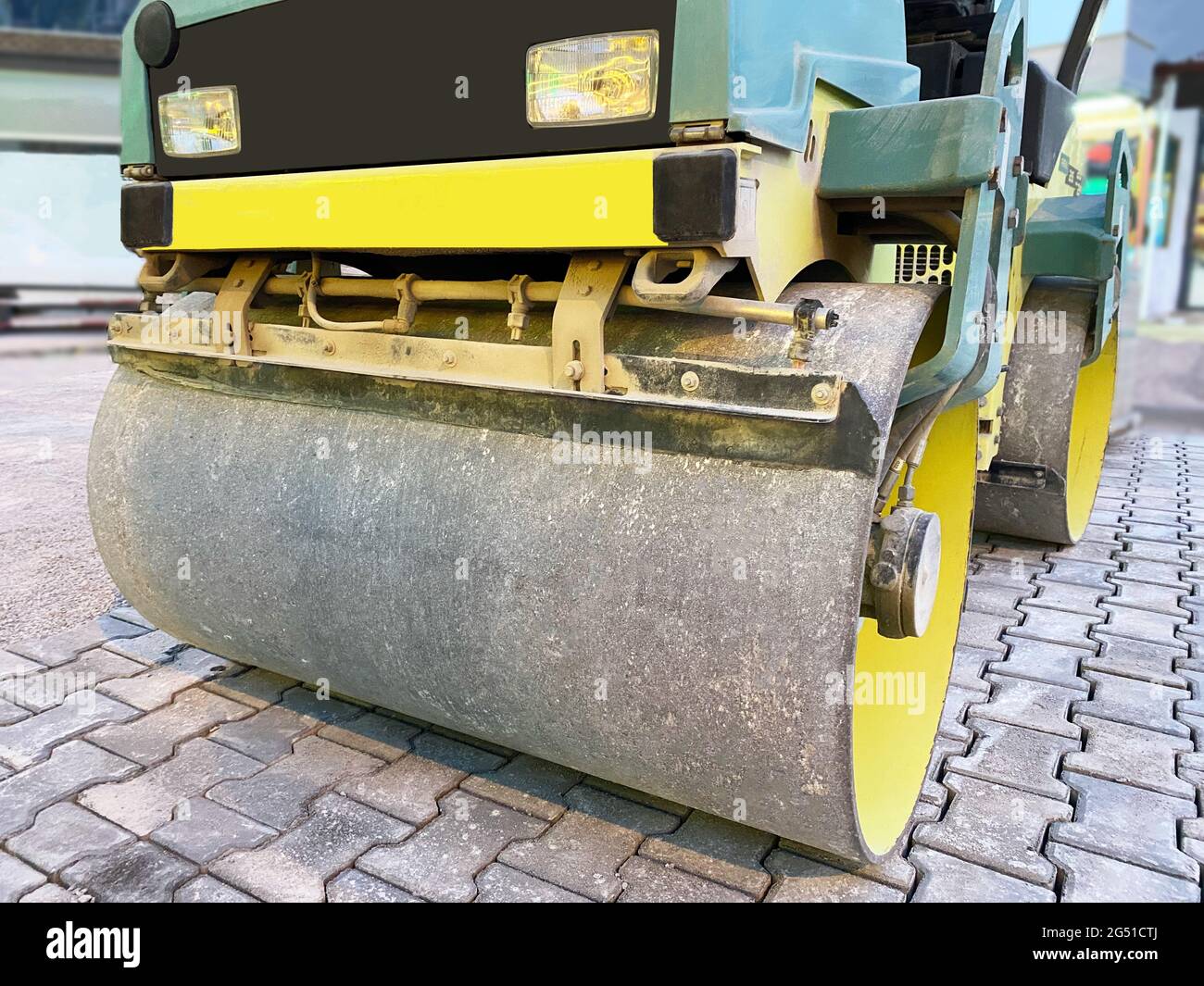 Steam roller, paving machine running on road work Stock Photo - Alamy