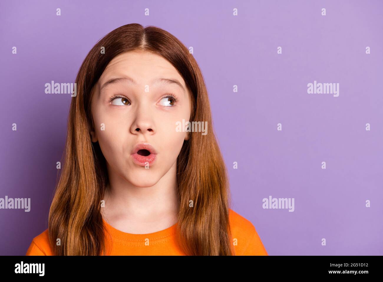 Photo of impressed nice foxy hair girl look empty space wear orange t ...