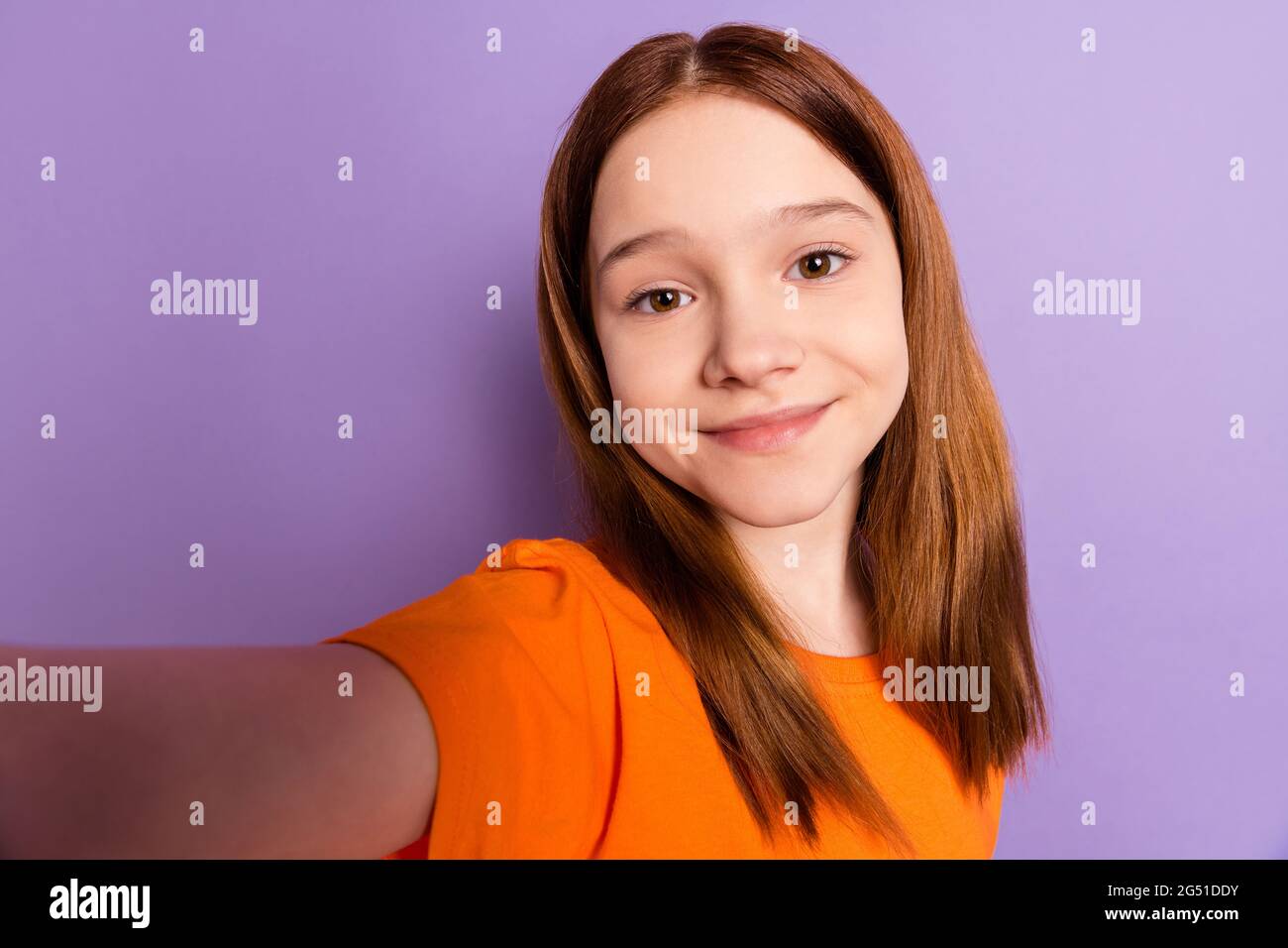 Photo of optimistic nice ginger hair girl do selfie wear orange t-shirt ...
