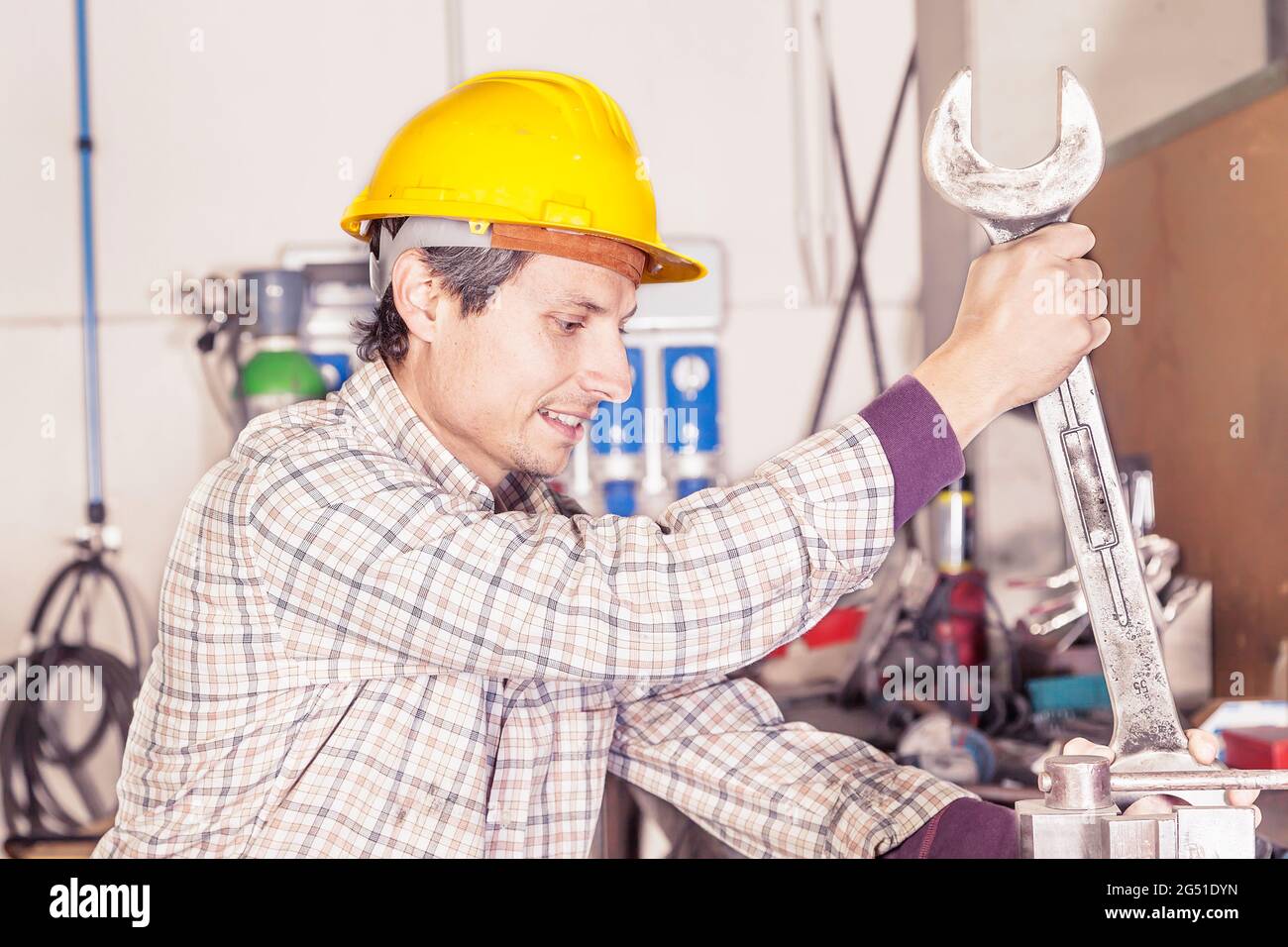 portrait of young metalworker engaged with wrench Stock Photo - Alamy