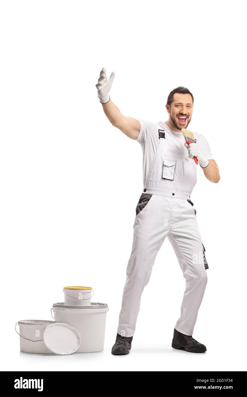 Full length portrait of a happy painter in a white uniform singing ...