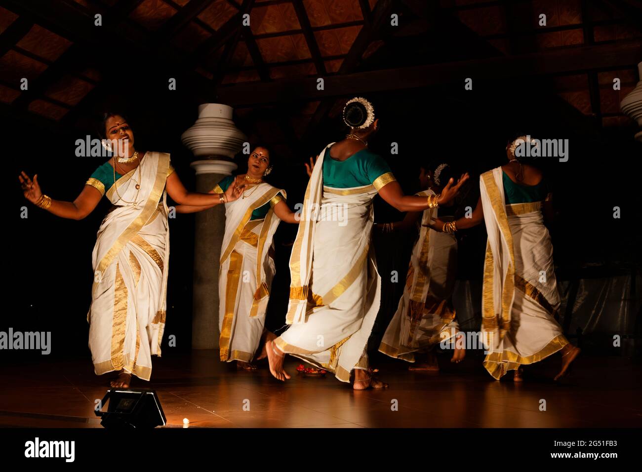 A traditional dance performance by dancers in sumptuous saris Stock ...