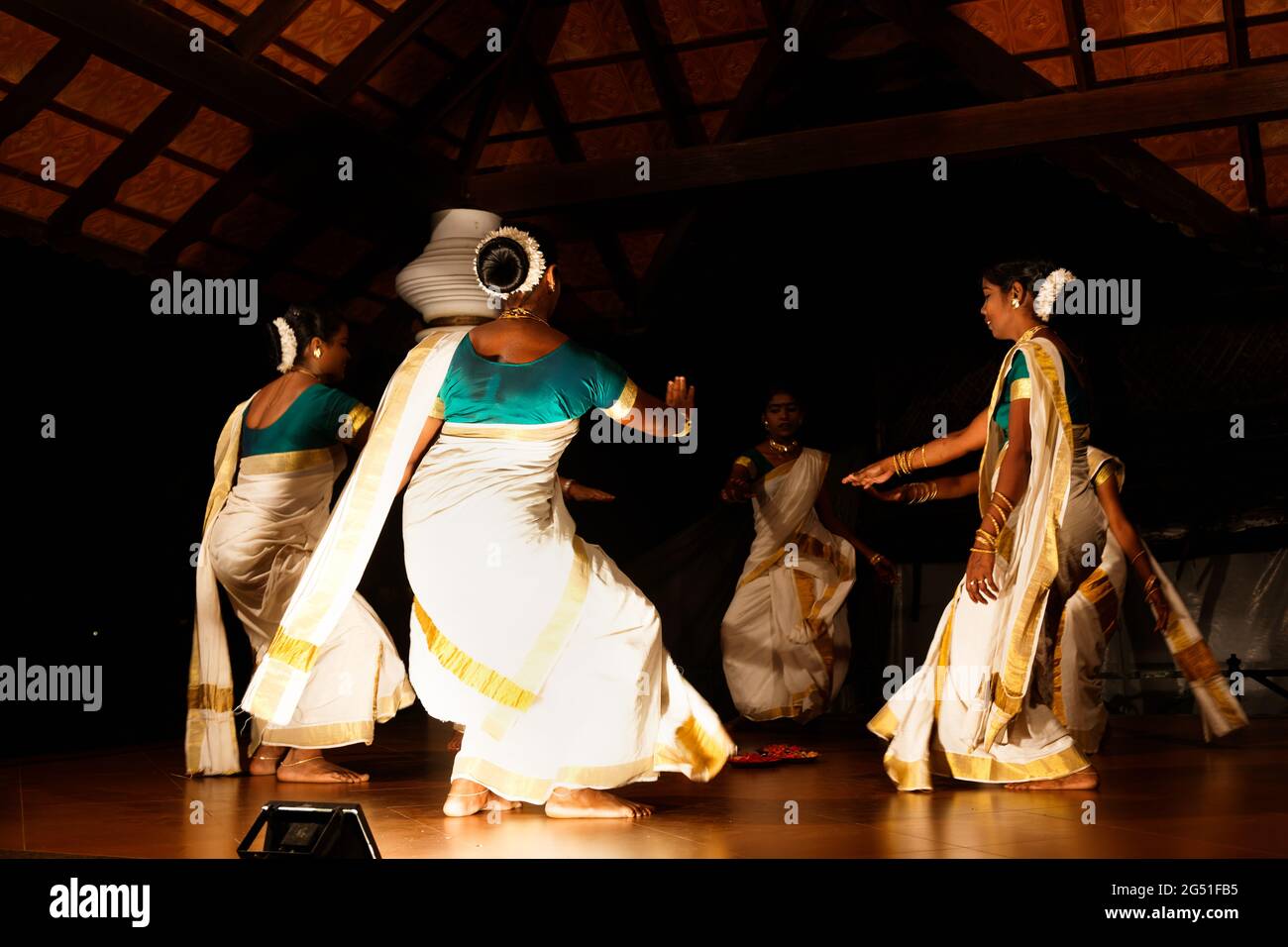 A traditional dance performance by dancers in sumptuous saris Stock ...
