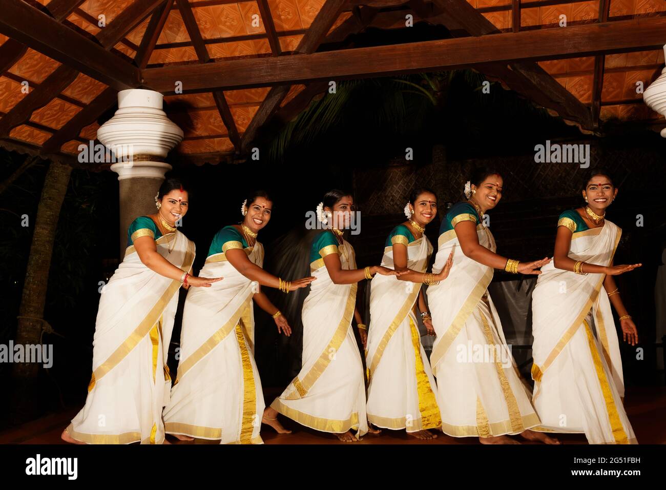 A traditional dance performance by dancers in sumptuous saris Stock ...