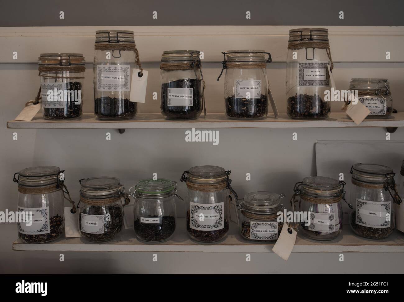 Closeup shot of different-sized labeled jars on the shelves Stock Photo ...