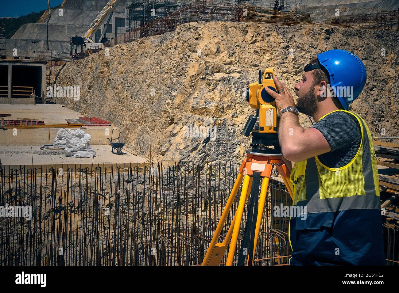 Land surveyor works at construction site Stock Photo - Alamy