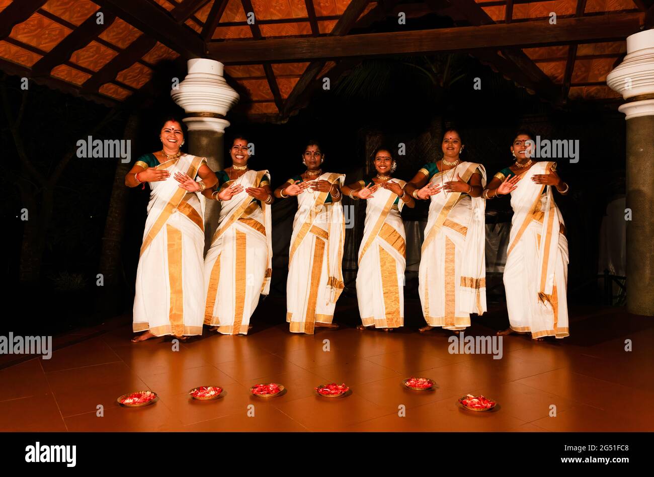 A traditional dance performance by dancers in sumptuous saris Stock ...