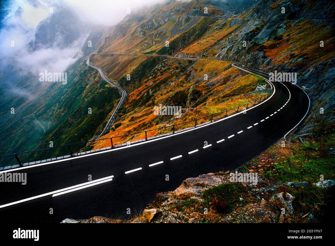 View of road on slope, Switzerland Stock Photo - Alamy