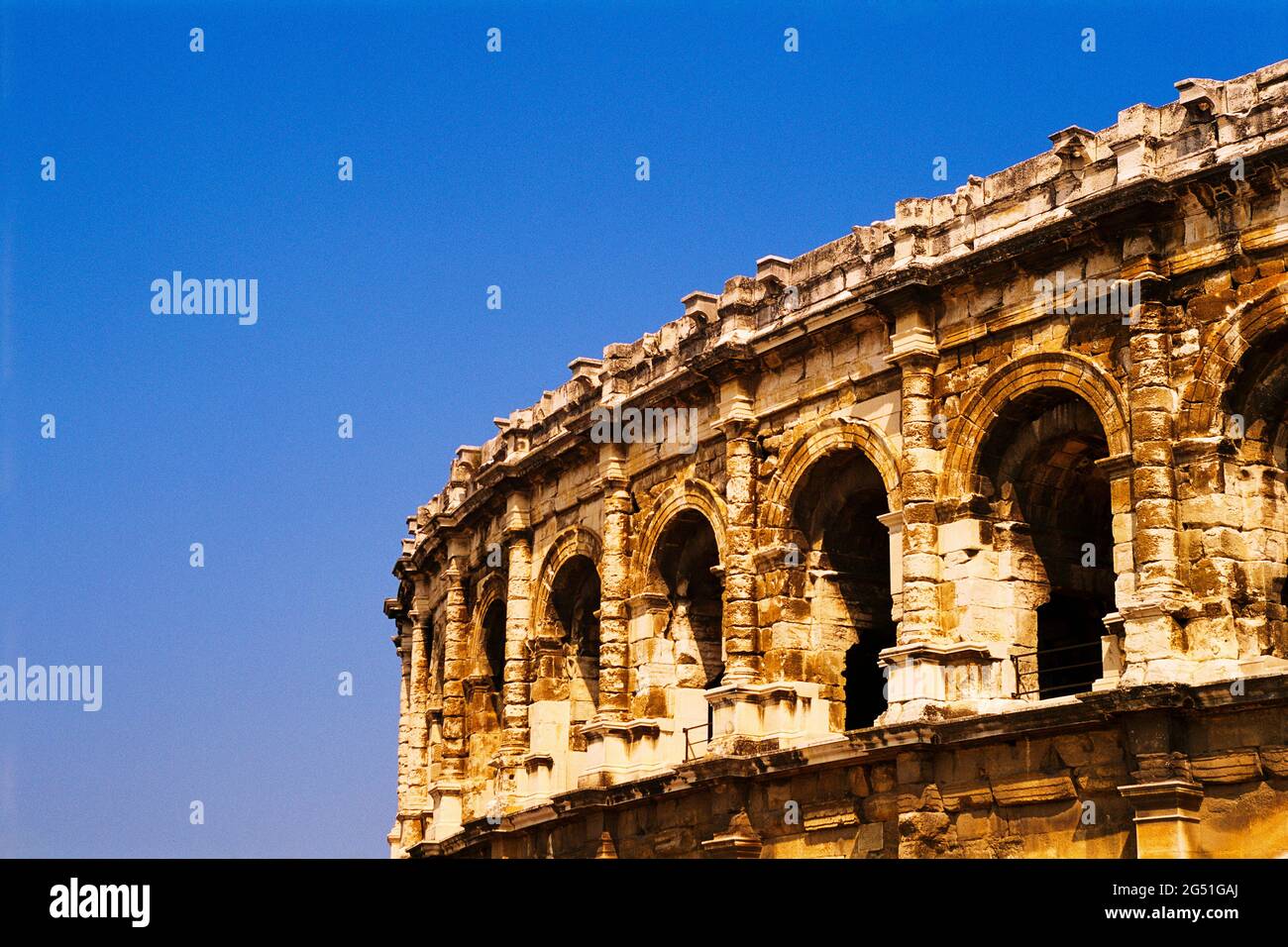 Ancient Roman amphitheater of Arena of Nimes against clear sky, Nimes ...