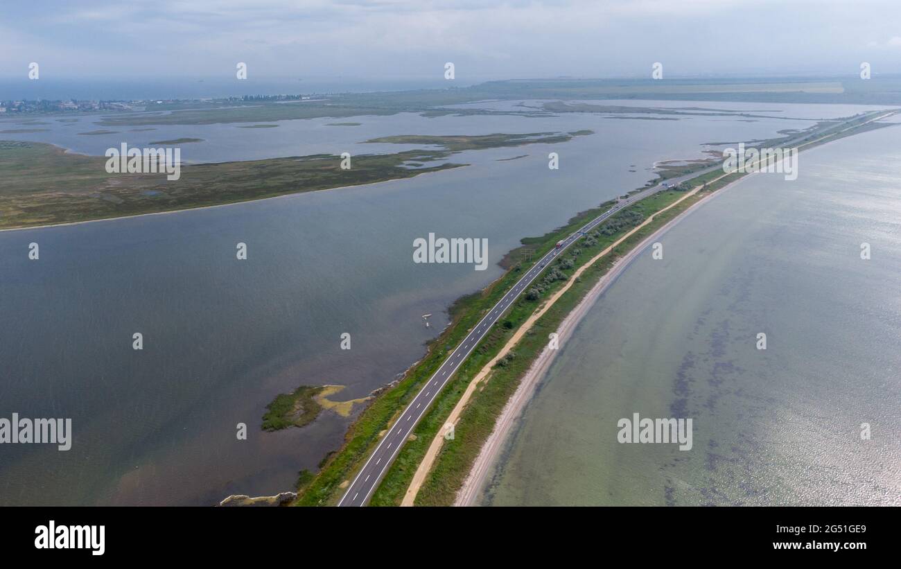 A highway that runs along a narrow spit between the sea and the estuary ...