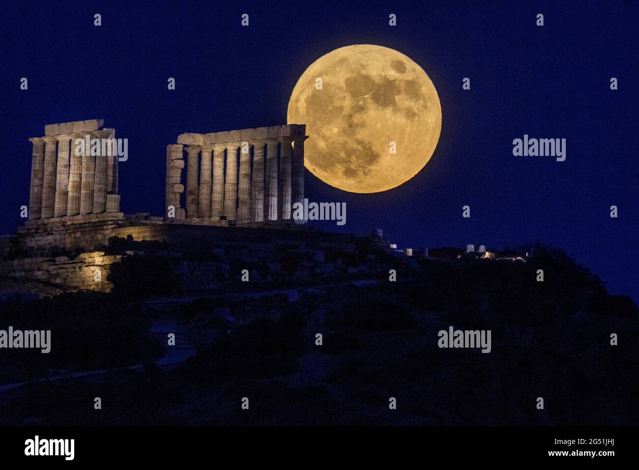 Athens, Greece. 24th Jun., 2021. The full moon rises over the Temple of ...