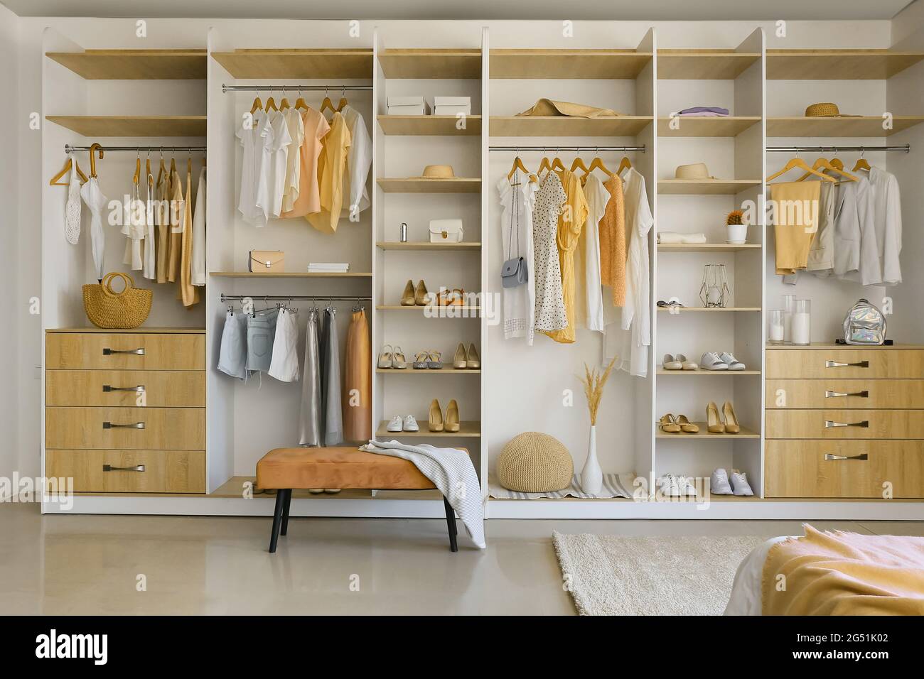 Big wardrobe with different clothes and accessories in room Stock Photo ...