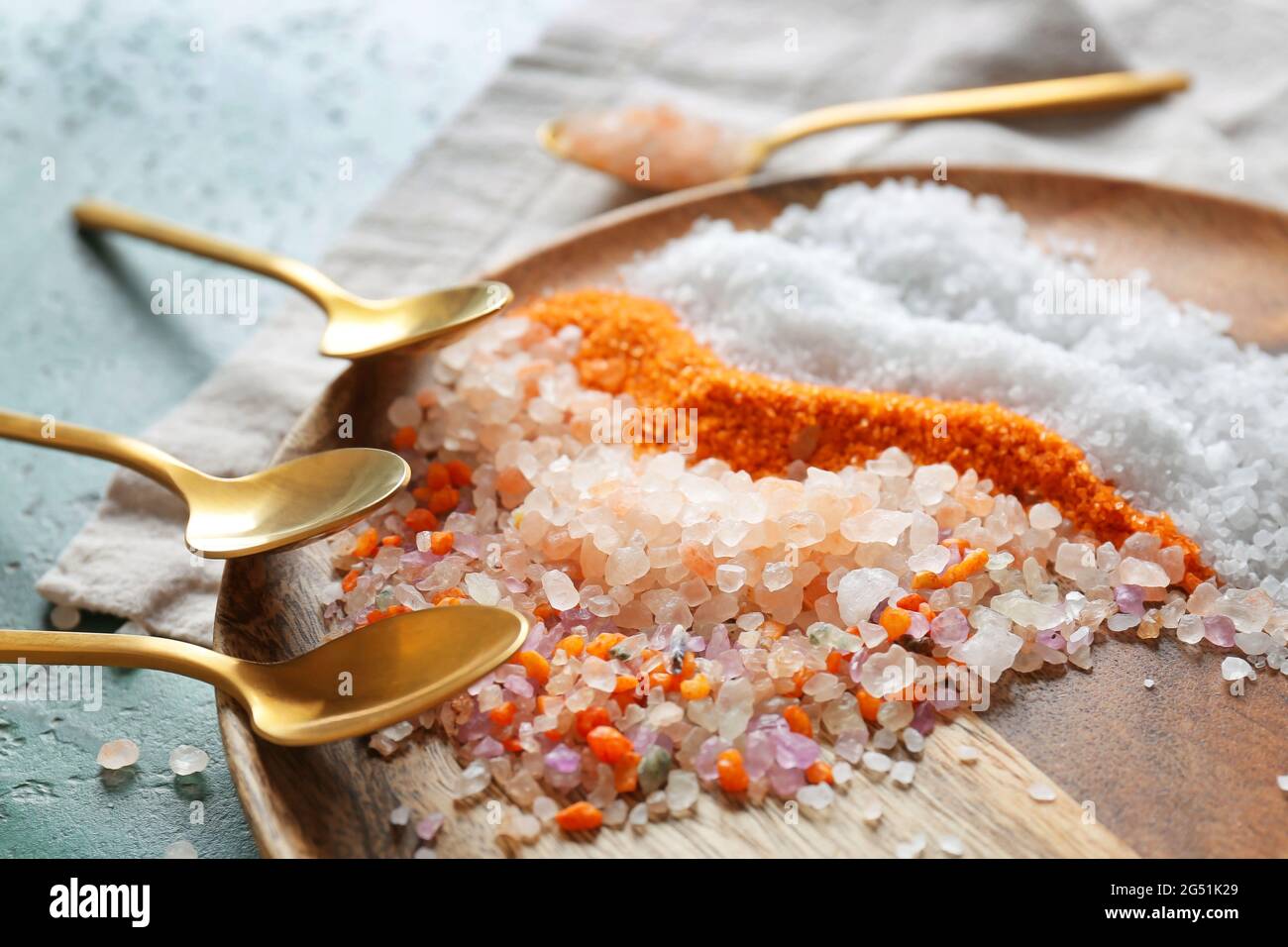 Composition with different salt on color background, closeup Stock ...