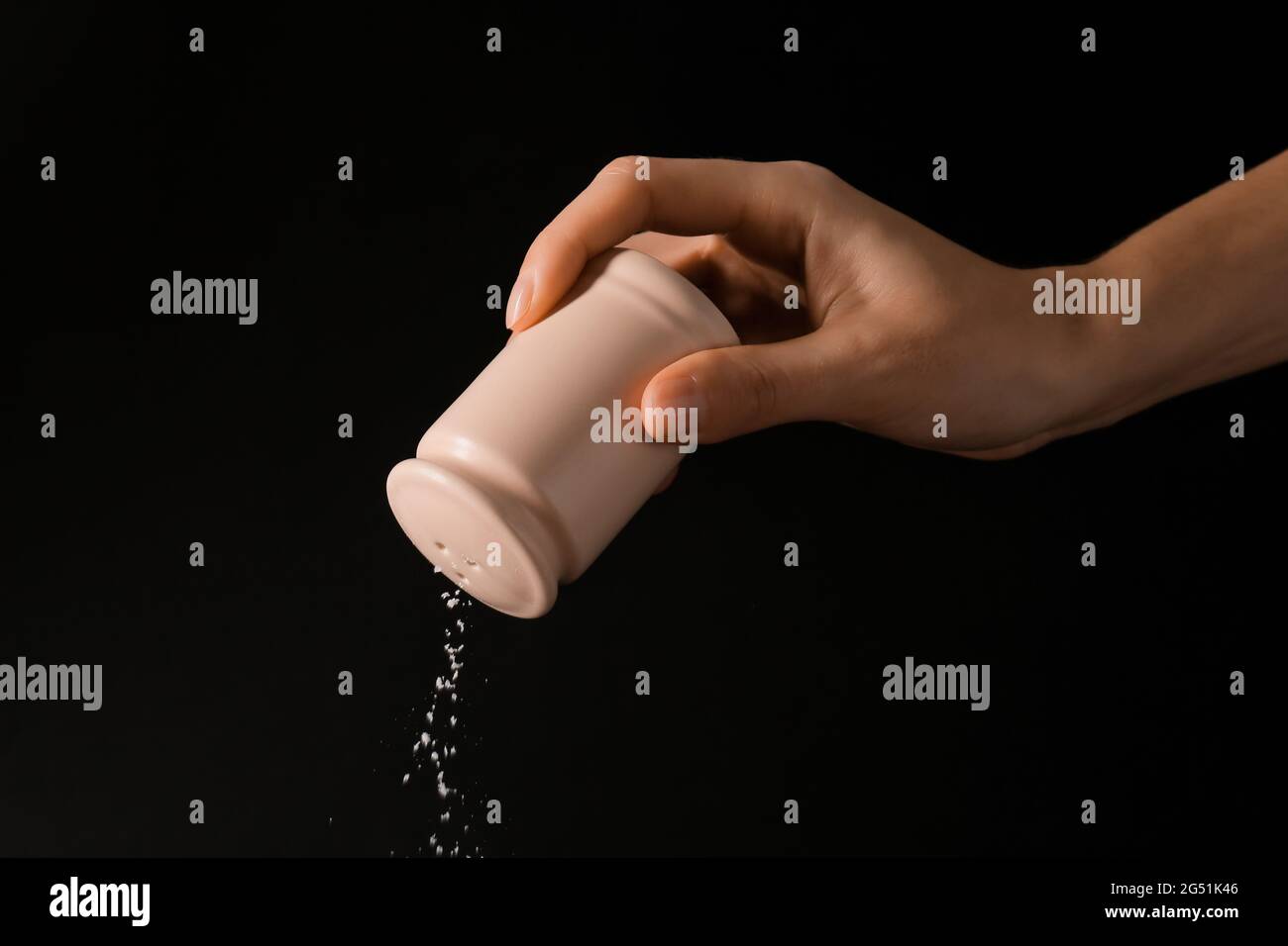 Female hand sprinkling salt hi-res stock photography and images - Alamy
