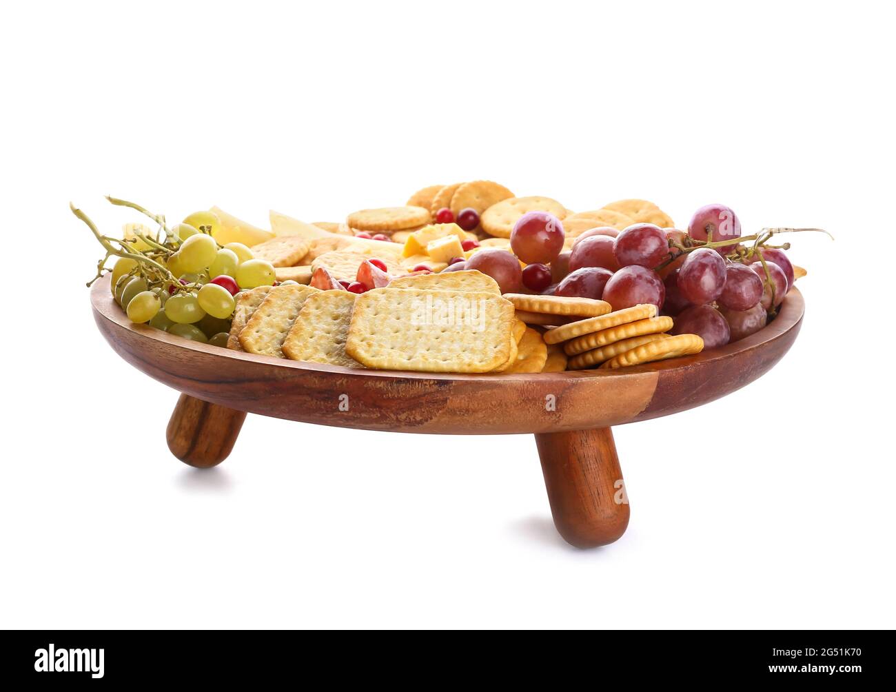 Stand with tasty crackers and snacks on white background Stock Photo ...