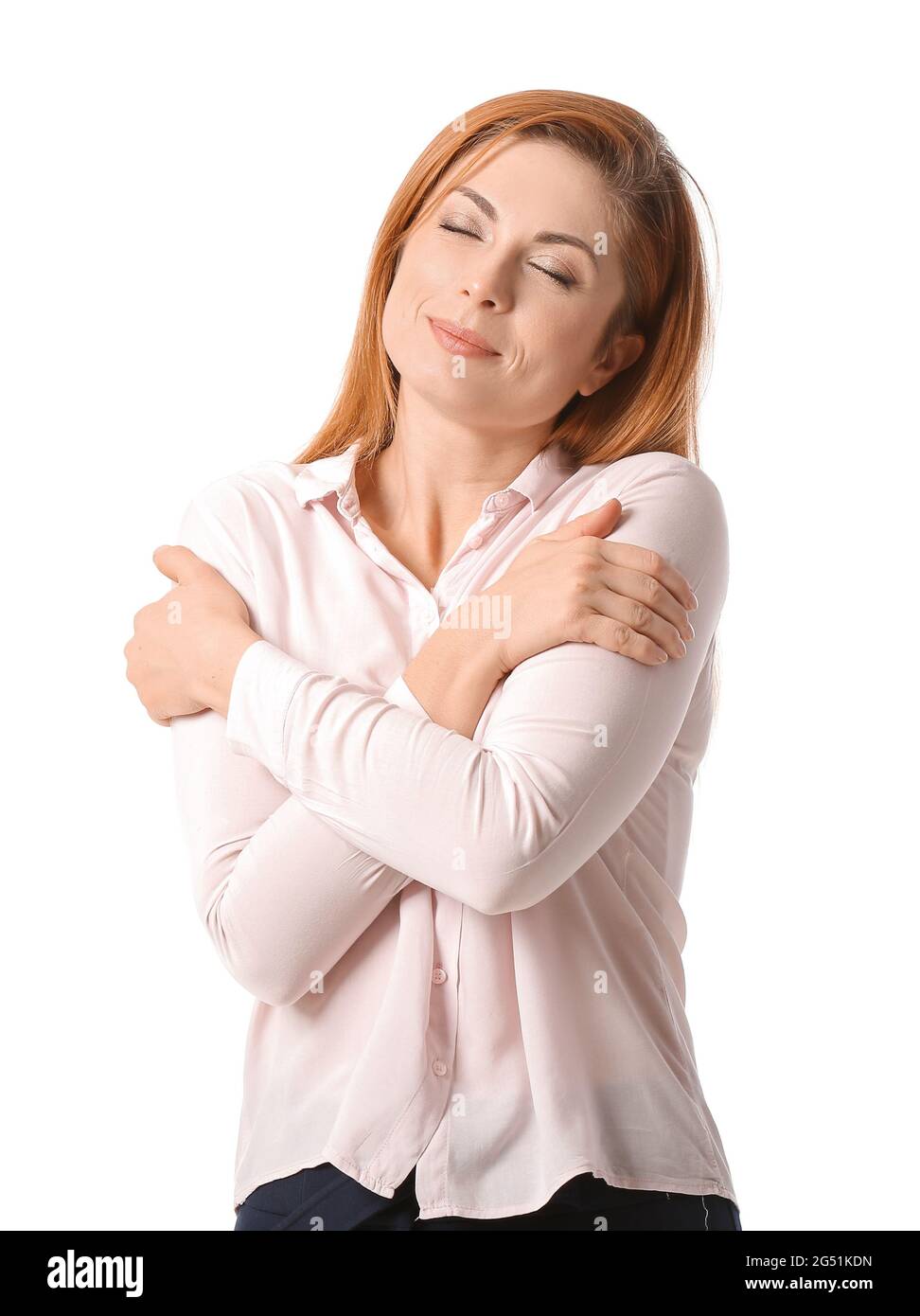 Happy woman hugging herself on white background Stock Photo - Alamy
