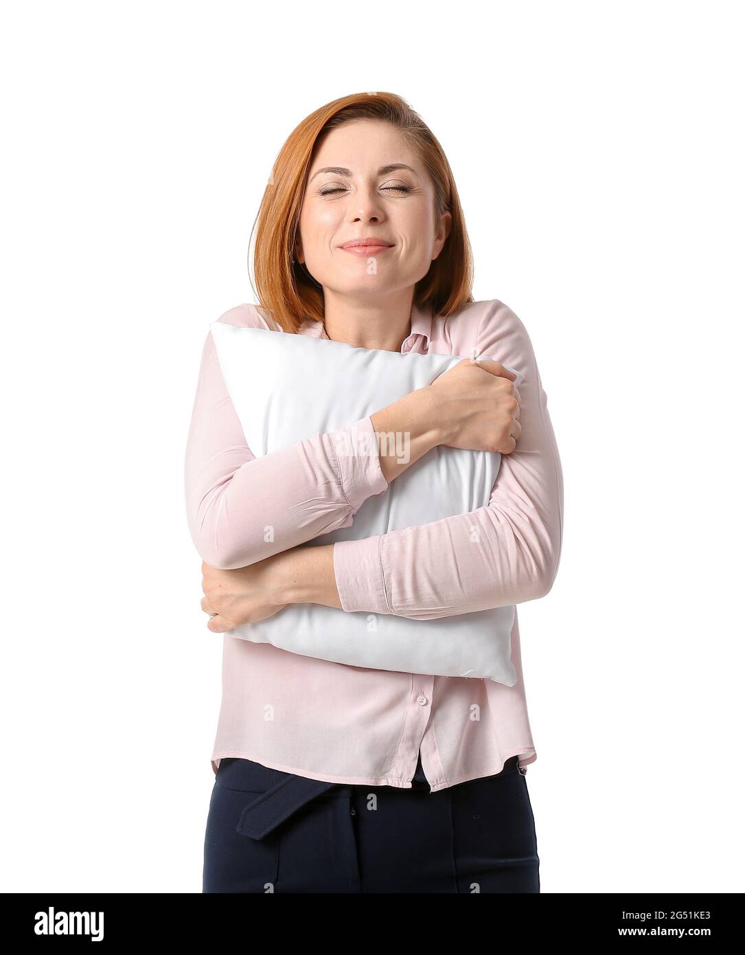 Beautiful woman hugging soft pillow on white background Stock Photo - Alamy