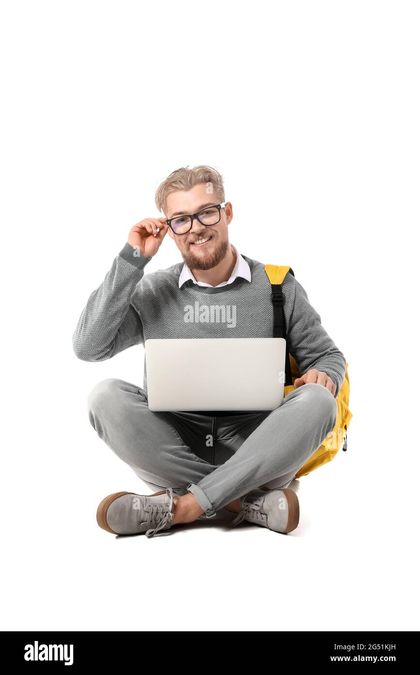 Male student with laptop on white background Stock Photo - Alamy