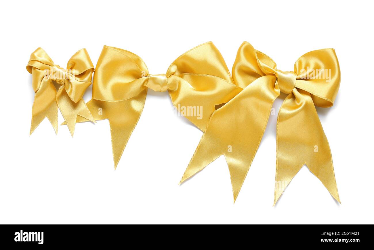 Beautiful golden bows on white background Stock Photo - Alamy