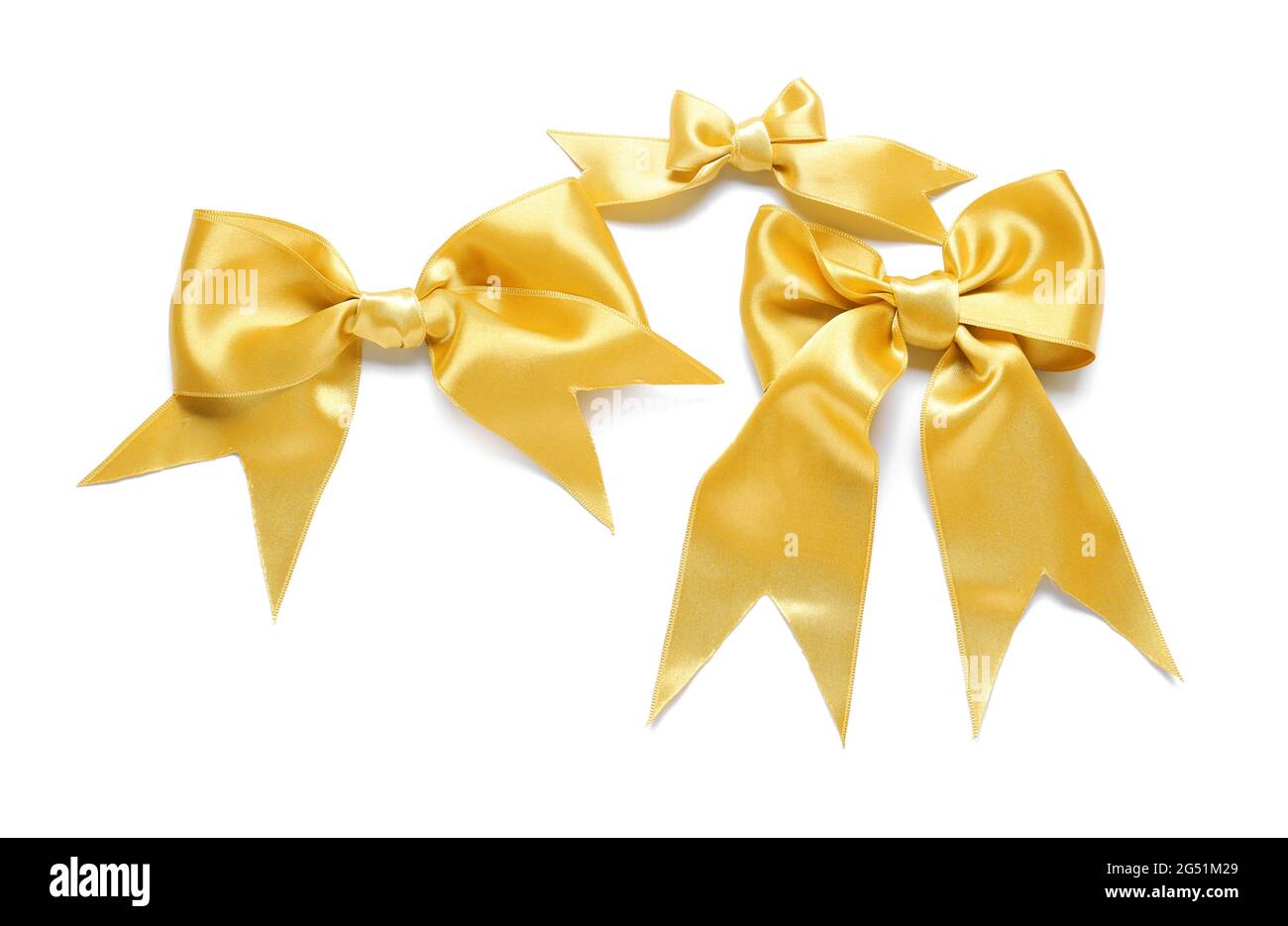 Beautiful golden bows on white background Stock Photo - Alamy