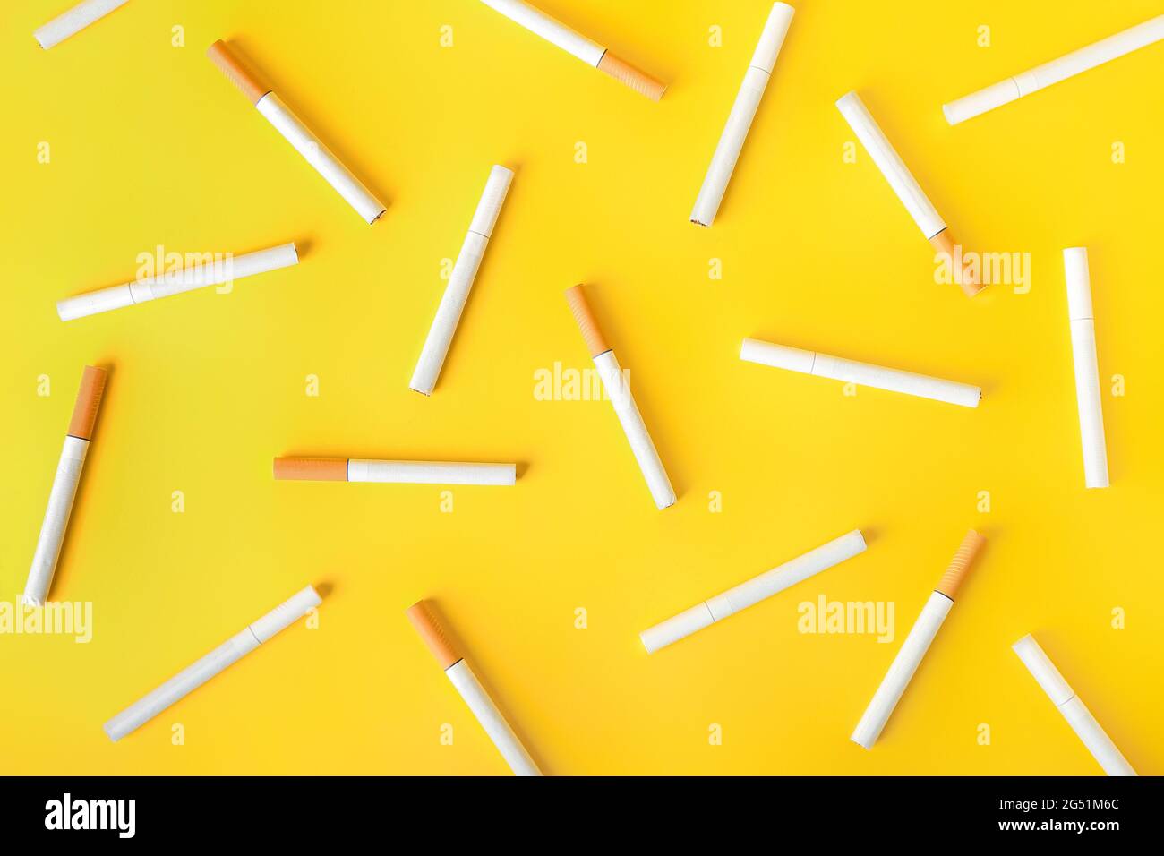 Many cigarettes on color background Stock Photo - Alamy