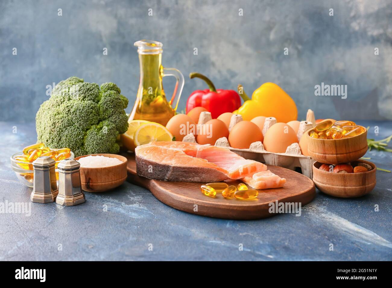 Set of healthy products with fish oil pills on color background Stock ...