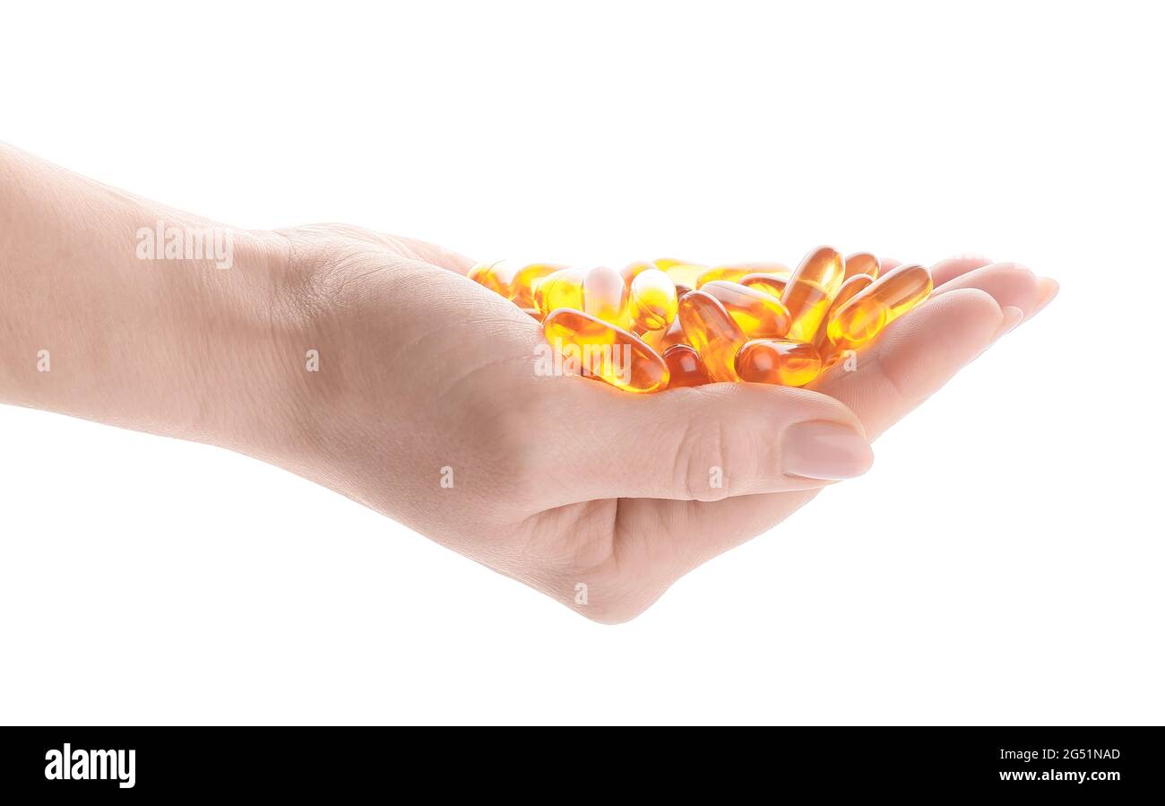 Cod liver oil capsules hand hi-res stock photography and images - Alamy