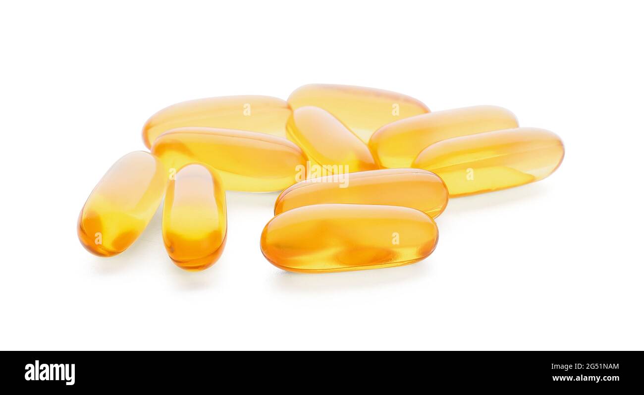 Fish oil capsules on white background Stock Photo - Alamy