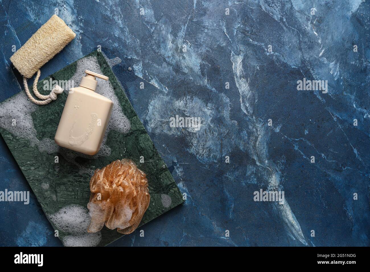 Bottle of shower gel with foam on color background Stock Photo - Alamy