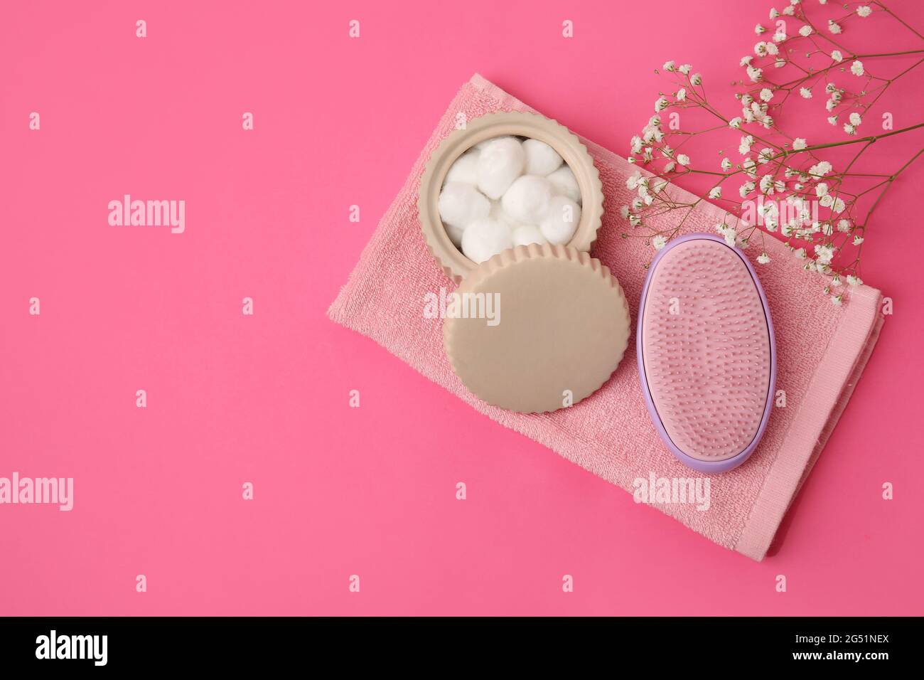 Hair brush, towel and cotton balls on color background Stock Photo - Alamy