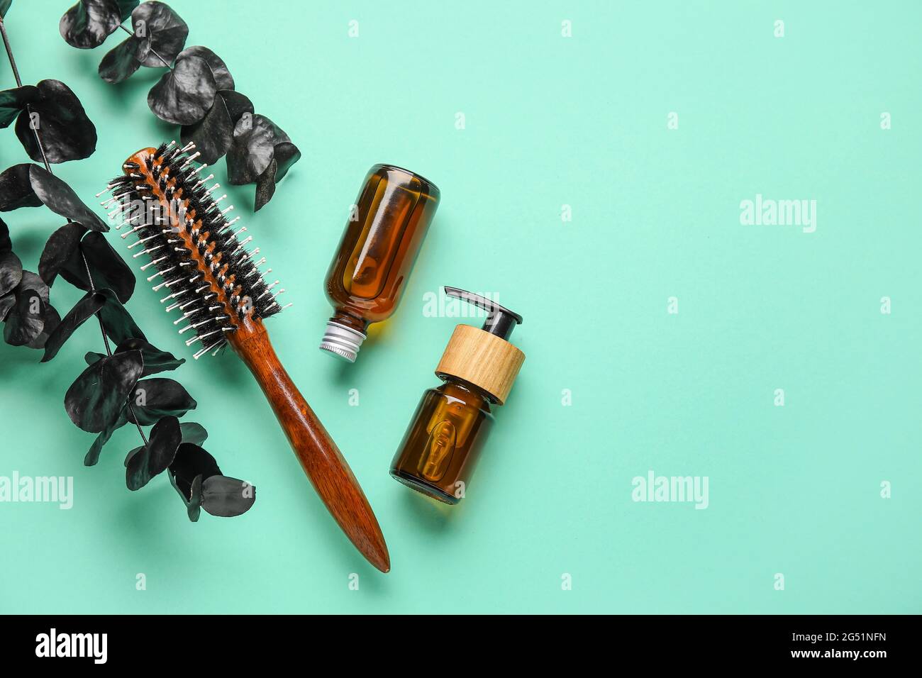 Hair brush and cosmetics on color background Stock Photo - Alamy