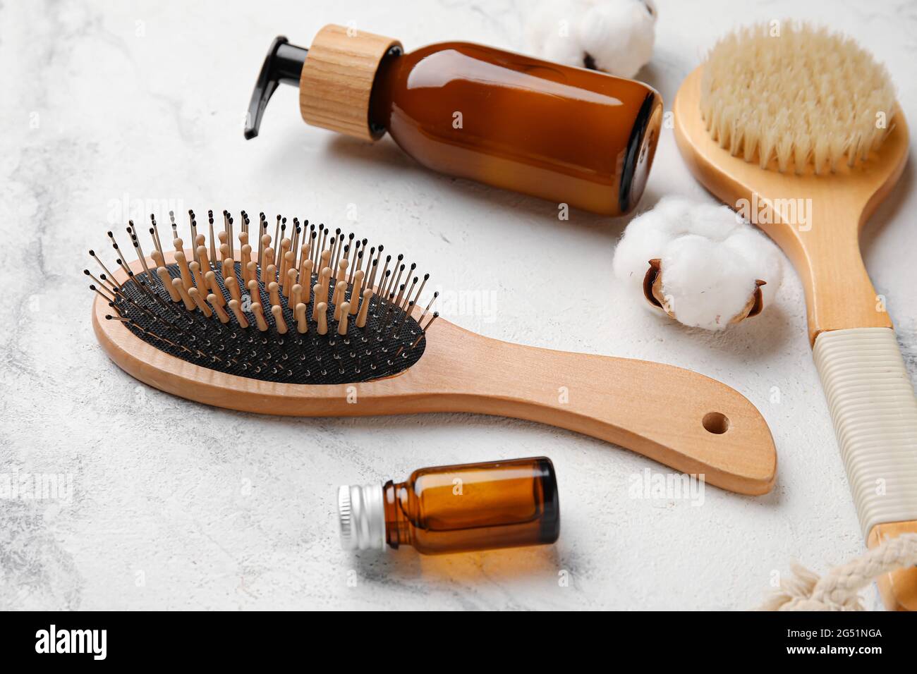 Composition with hair brush and cosmetics on light background Stock ...