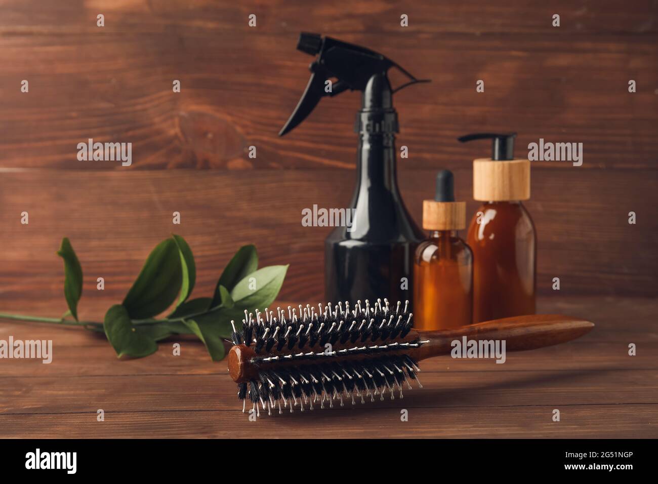 Hair brush and cosmetics on wooden background Stock Photo - Alamy