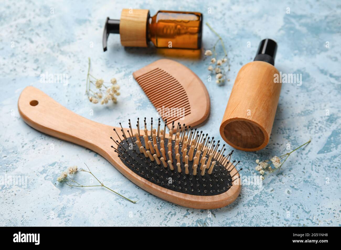 Hair comb, brush and cosmetics on color background Stock Photo - Alamy