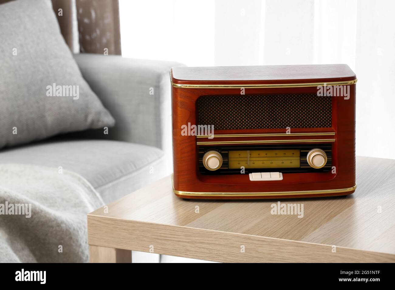 Retro radio receiver on table in interior of room, closeup Stock Photo ...