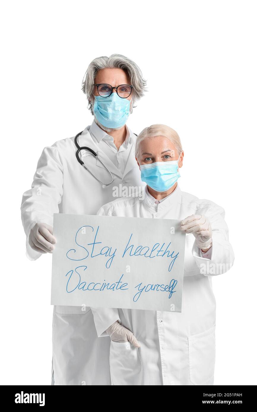 Doctors holding poster with text STAY HEALTHY - VACCINATE YOURSELF on ...