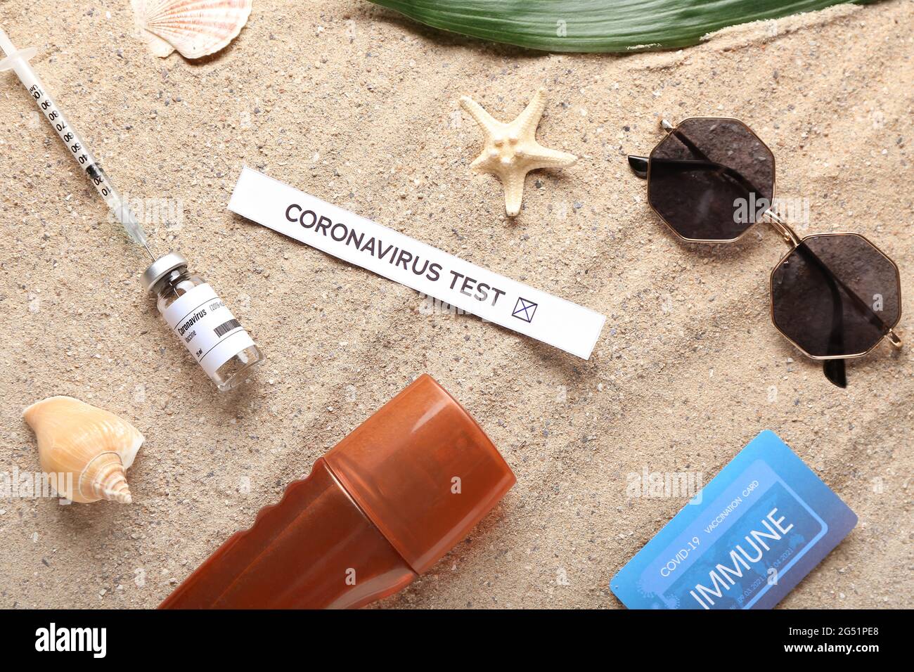 Immune card, covid-19 test result and vaccine on beach Stock Photo - Alamy