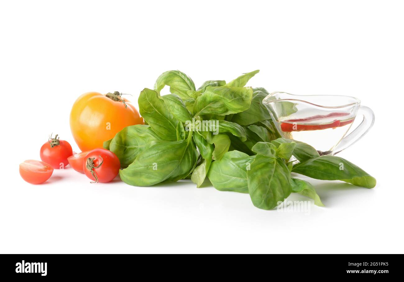 Fresh basil leaves and products on white background Stock Photo - Alamy