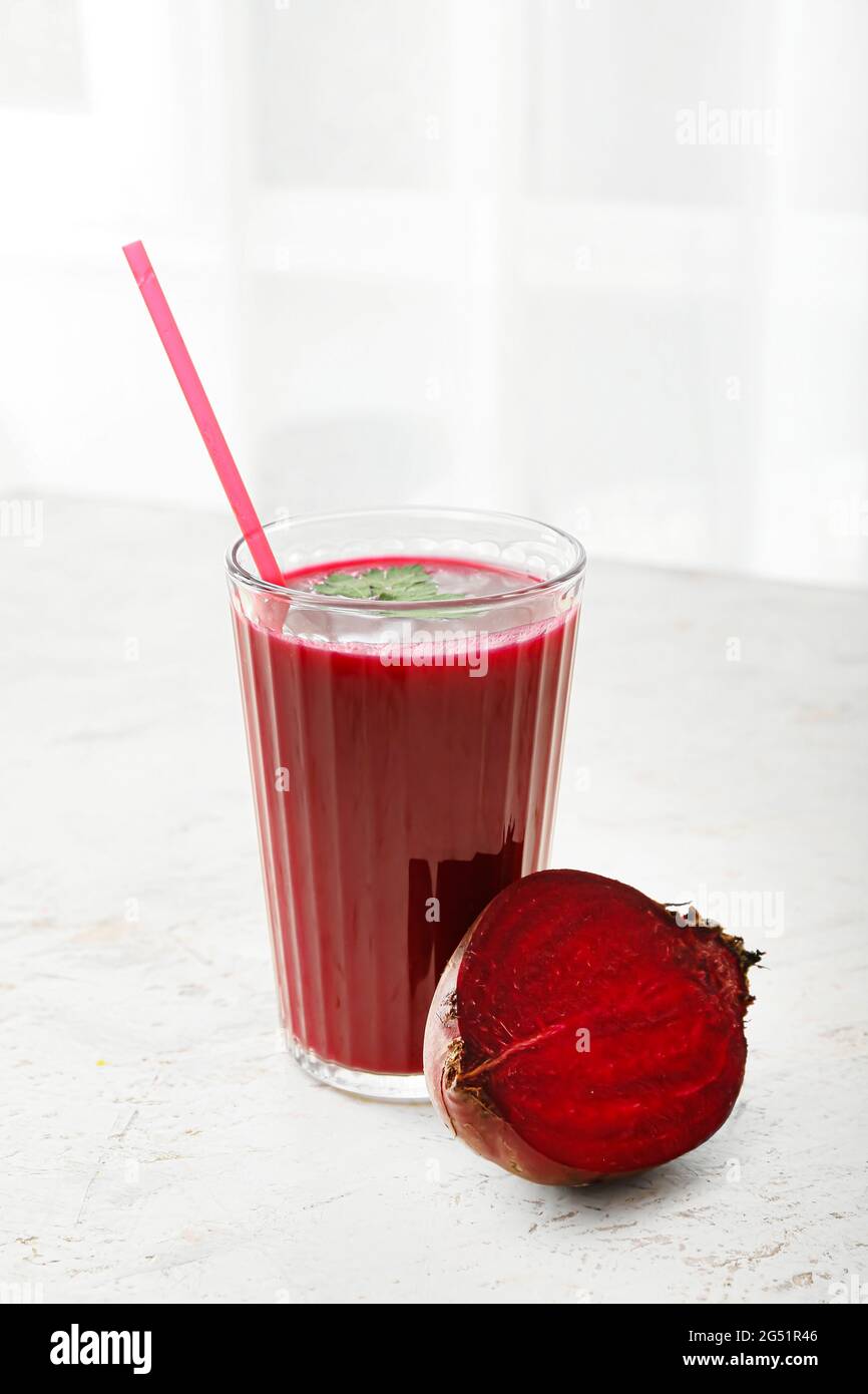 Glass of healthy smoothie with beetroot on light background Stock Photo ...