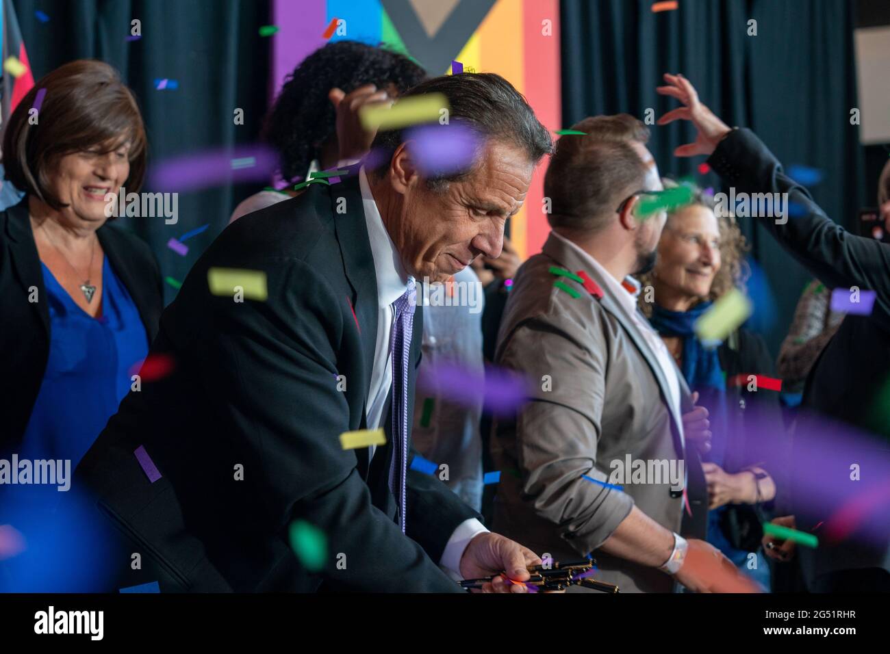 NEW YORK, NEW YORK - JUNE 24: Rainbow confetti fall during a press ...