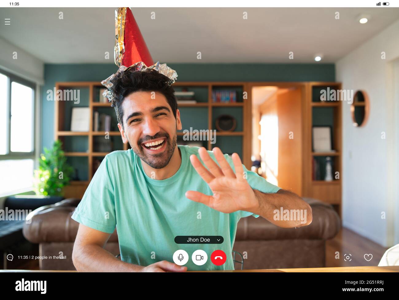 Man celebrating his birthday on a video call Stock Photo - Alamy