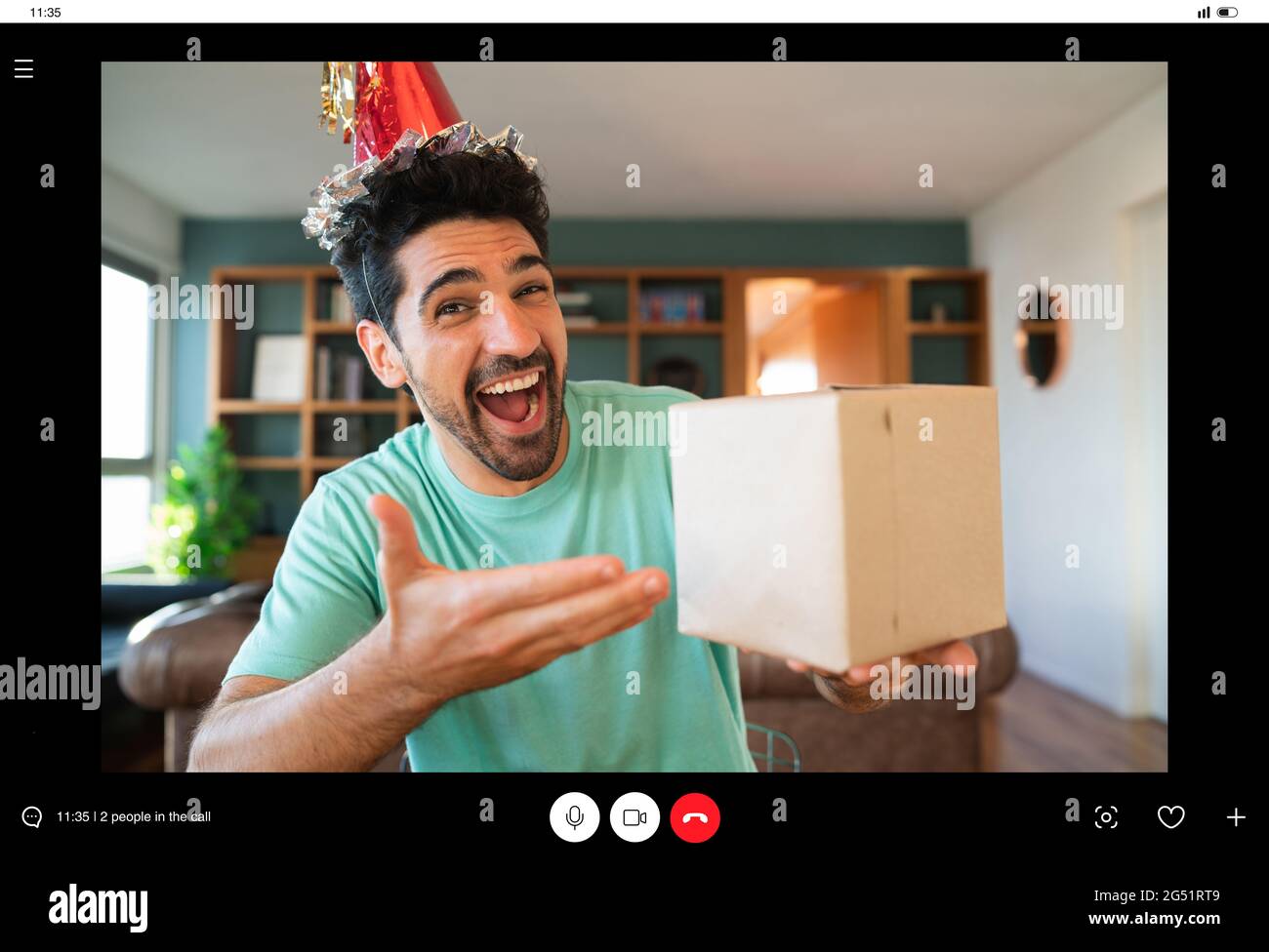 Man celebrating his birthday on a video call Stock Photo - Alamy