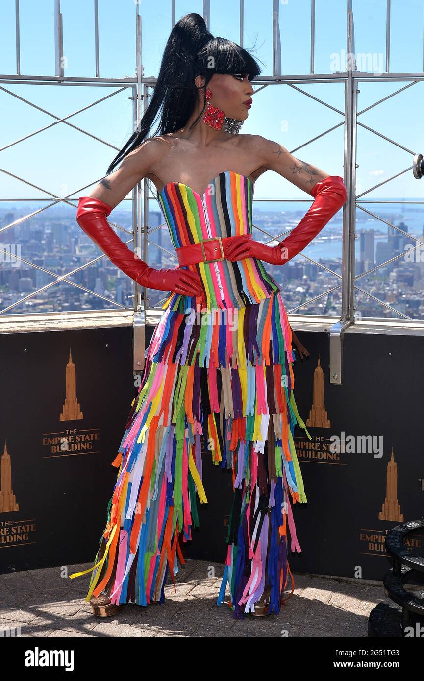 New York, USA. 24th June, 2021. Trinity K. Bonet poses as the Empire State Building hosts the ...