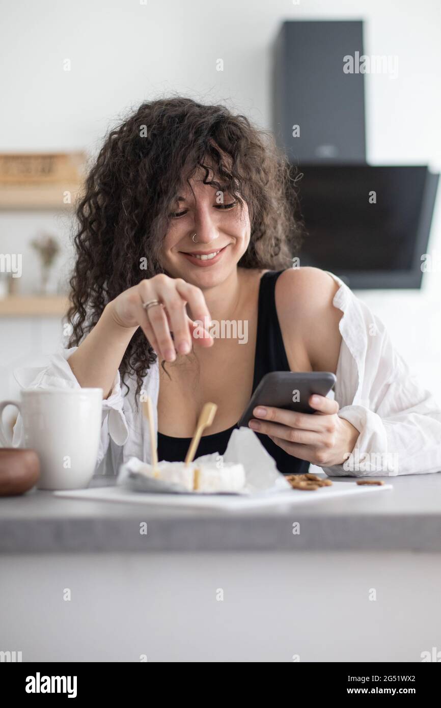 Young domestic feminine typing message texting communicate social ...